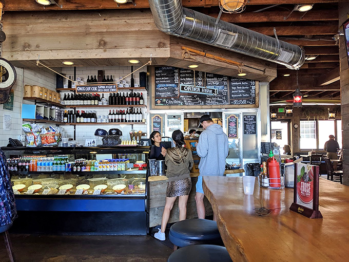 Where culinary magic begins: chalkboard menus, friendly faces, and the promise of coastal comfort food just moments away.