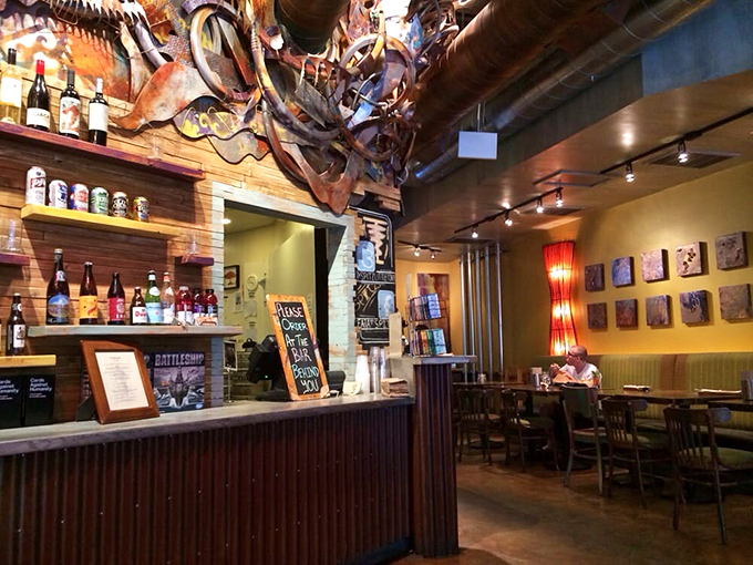 Wooden warmth meets artistic chaos &ndash; exposed pipes and colorful accents create a space that feels both carefully designed and spontaneously cool.