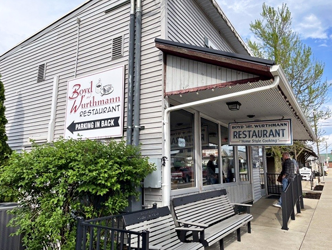 The exterior view shows a restaurant that doesn't need to shout about its authenticity&mdash;the wooden benches have been welcoming weary shoppers for decades.
