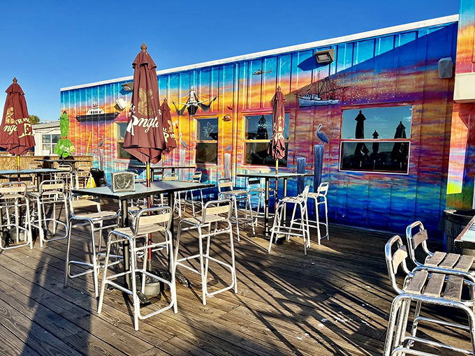 Outdoor seating where the ocean breeze serves as both air conditioning and appetite enhancer. The colorful mural isn't art &ndash; it's autobiography.