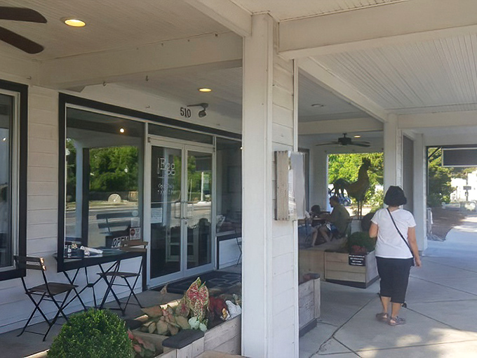Outdoor dining under blue umbrellas adds vacation vibes to your breakfast experience. Sea breeze with a side of eggs? Yes, please.
