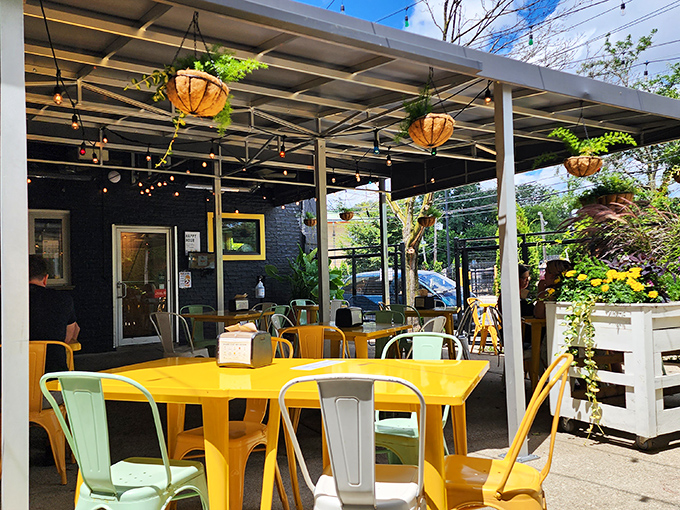 The outdoor patio with its cheerful yellow tables and hanging plants makes summer in Chicago 30% more delightful, scientifically speaking.