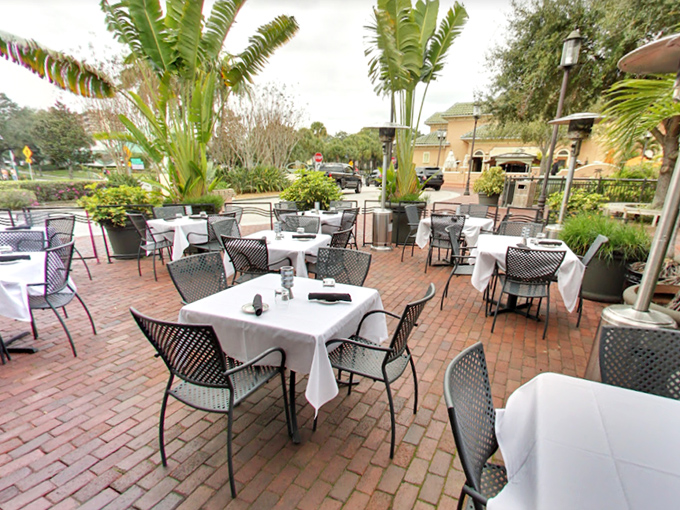 Al fresco dining Florida-style, where palm fronds provide nature's ceiling fans and every breeze carries a hint of possibility.