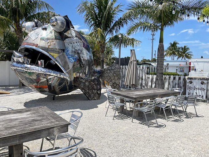 The outdoor dining area features a massive metal grouper sculpture&mdash;proof that "ugly" can indeed be spectacular art.
