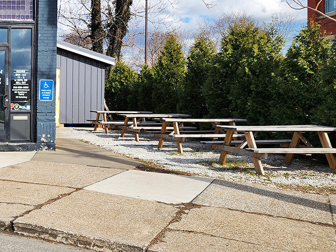 When weather permits, these picnic tables become prime real estate for Erie's barbecue aficionados seeking fresh air with their smoked treasures.