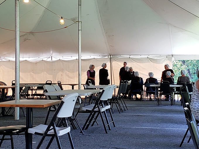 Even under canvas, the community spirit thrives—a testament to food's power to bring people together regardless of setting.