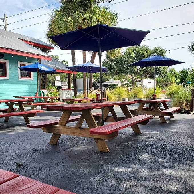 Florida dining at its most authentic: picnic tables, palm trees, and the promise of seafood that was swimming yesterday.