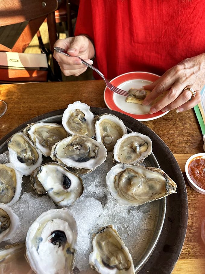 Oysters displayed like jewels on a silver platter. Each one a tiny ocean miracle waiting to slide down your throat and change your day for the better.