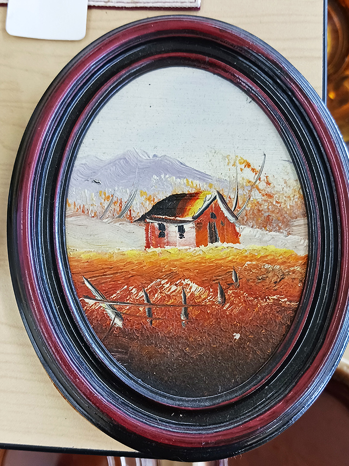 Small paintings tell big stories. This rustic cabin scene in its vintage oval frame practically whispers "cozy weekend getaway" to anyone who passes by.