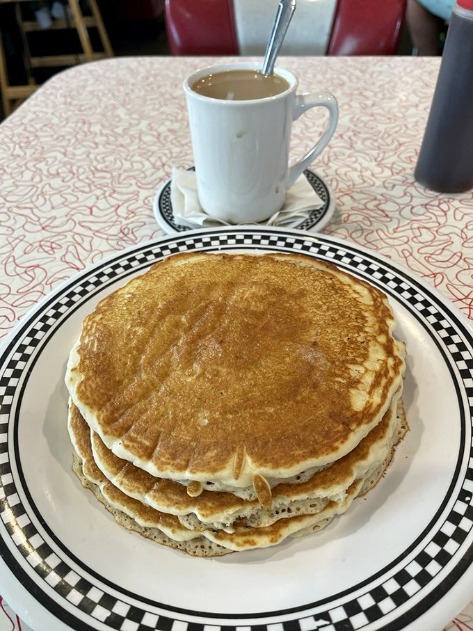 Pancake perfection that would make your grandmother both proud and jealous. The coffee cup stands guard, knowing its contents are essential companions.