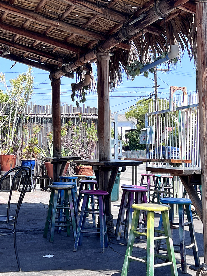 The patio's colorful stools are like a beach party where everyone's invited. Al fresco dining with a side of Los Angeles sunshine.