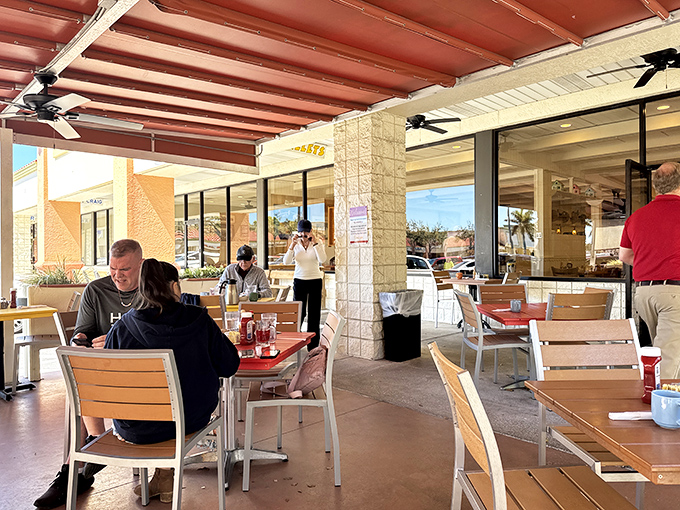 Al fresco dining Florida-style, where the morning breeze carries conversations and coffee aromas under a terra cotta canopy.