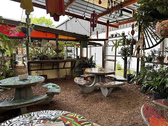 The garden patio feels like dining in a creative fever dream, with mosaic tables that are functional art pieces telling stories of their own.