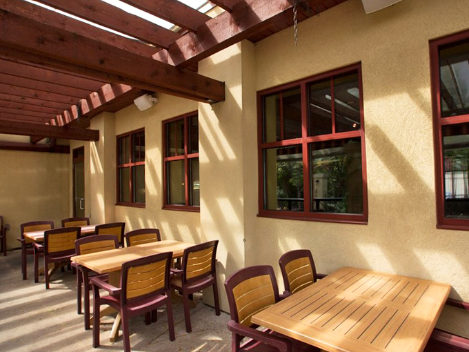 Sunlight streams through the pergola, creating the perfect outdoor dining spot for those "too nice to be inside" Pennsylvania days.