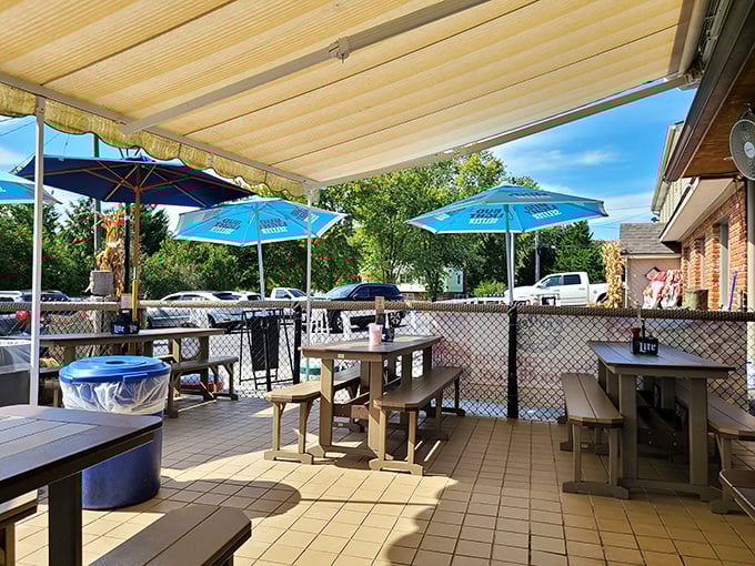 The outdoor seating area offers fresh air, blue umbrellas, and the perfect backdrop for that "I'm on vacation even though I live 20 minutes away" feeling.