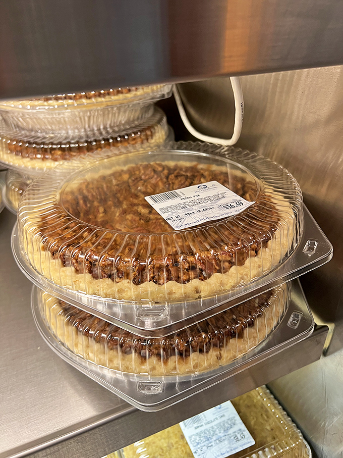 Pecan pies stacked and ready for adoption. These aren't just desserts&mdash;they're the reason people invented the phrase "I shouldn't, but I will."