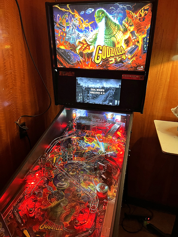 Even Godzilla takes a break from destroying cities to enjoy some pinball at Happy Dog. The vintage machine adds another layer of nostalgic fun to your visit.