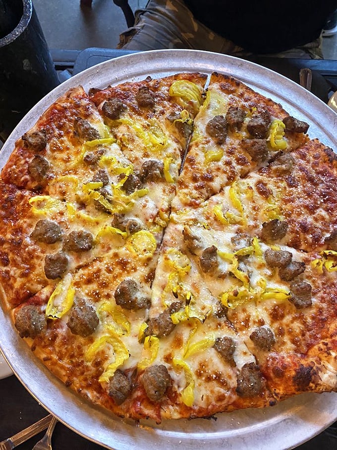 A pizza that doesn't need to show off with trendy toppings&mdash;just perfectly balanced cheese, sauce, and those little islands of sausage that make every bite an adventure.