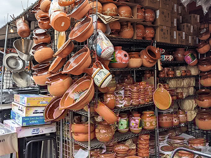 Clay pots hanging like terracotta fruit, ready to transform your kitchen from "microwave enthusiast" to "authentic home chef" in one purchase.