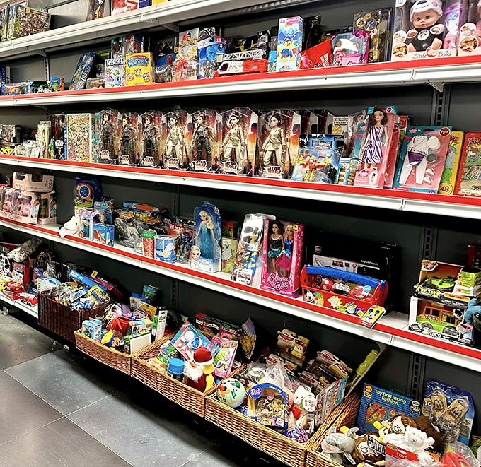 Toy shelves packed tighter than a carry-on suitcase, with action figures and dolls that span generations of childhood memories.