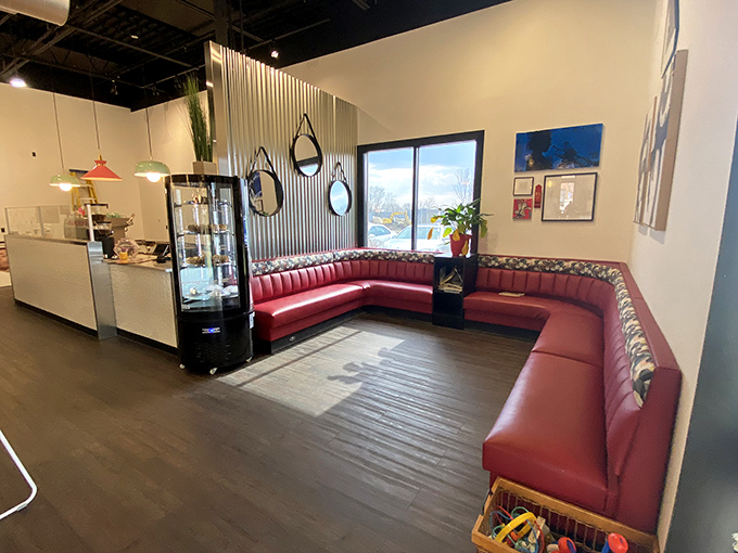 The curved red banquette isn't just seating&mdash;it's a front-row ticket to the breakfast show. Comfort never looked so stylish.