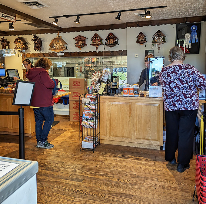 Cuckoo clocks keep watchful eyes over the checkout counter, ticking away the minutes until your next cheese adventure begins.
