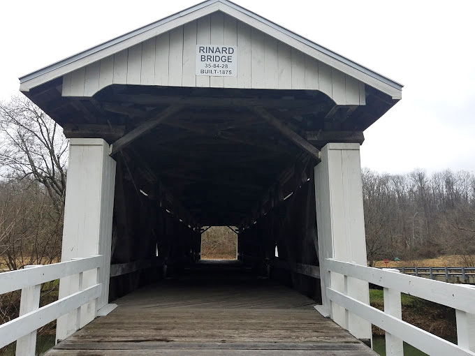 The entrance portal frames the countryside beyond like a living, breathing work of art.