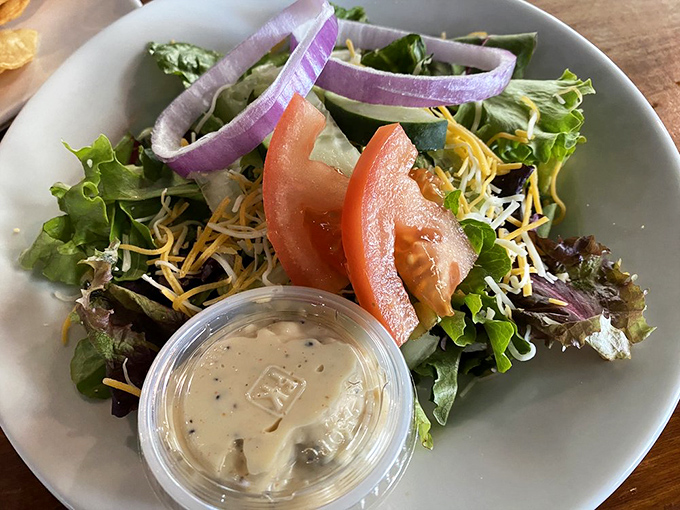 Even the salads show up dressed to impress. Fresh, colorful, and making you feel slightly virtuous before you order that second biscuit.