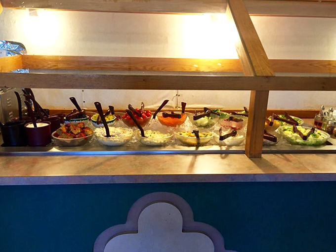 The salad bar lineup&mdash;nature's candy store for adults who occasionally remember they should eat something green between pancake sessions.