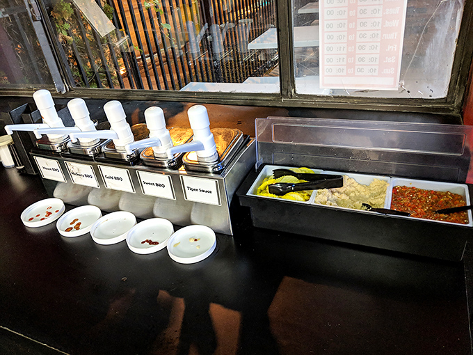 The condiment station &ndash; where tiger sauce, barbecue sauce, and other flavor enhancers stand ready to customize your meat masterpiece to personal perfection.