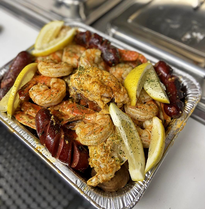 Shrimp and sausage in perfect harmony, with lemon wedges standing by for that citrus kick. A tin tray never held such treasure.