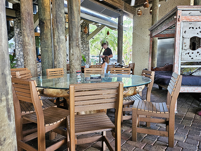 Nature becomes part of the dining experience with tree trunks serving as both structural supports and conversation starters.