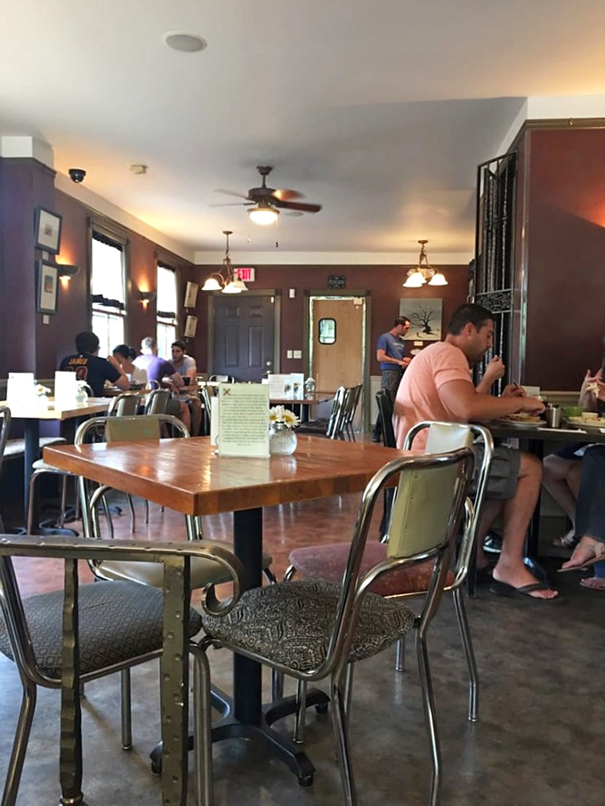 The dining room buzzes with that perfect caf&eacute; energy&mdash;warm lighting, wooden tables, and the collective happiness of people about to enjoy something delicious.
