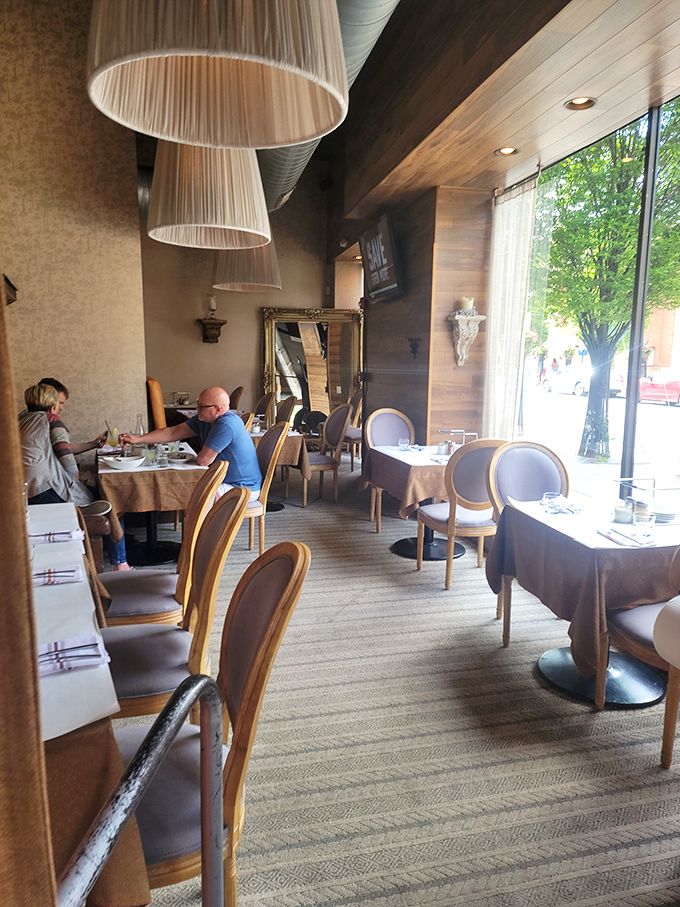 Dining room elegance without pretension. Those drum lampshades diffuse light that makes everyone look like they've just returned from vacation&mdash;rested and ready for pasta.