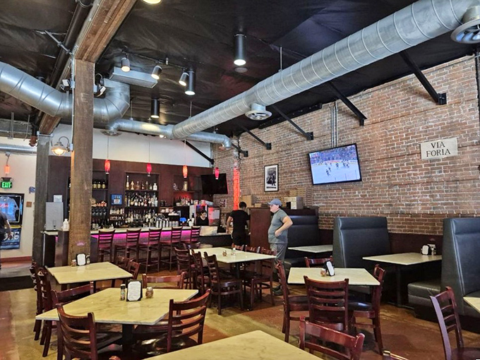 The dining room strikes that perfect balance between rustic and refined, with exposed brick walls that could tell stories of Italy.