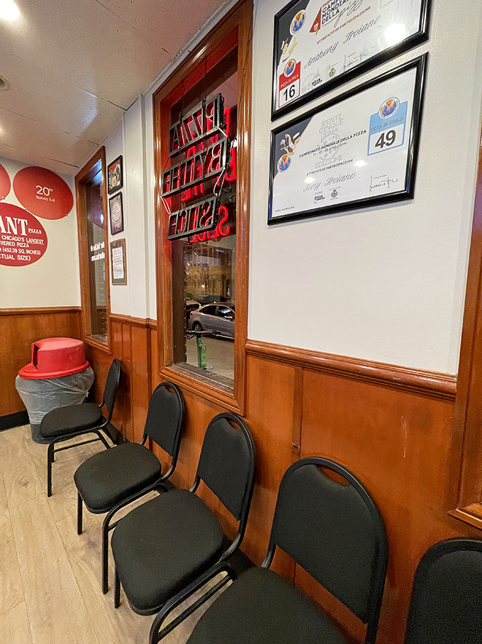 The wall of fame tells stories of neighborhood history while you wait. These certificates aren't just paper—they're edible achievements.