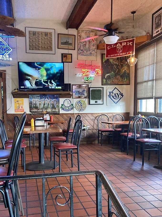 Sports memorabilia covers the walls like a scrapbook of local history. The Tampa Bay Rays banner reminds you you're in baseball country.