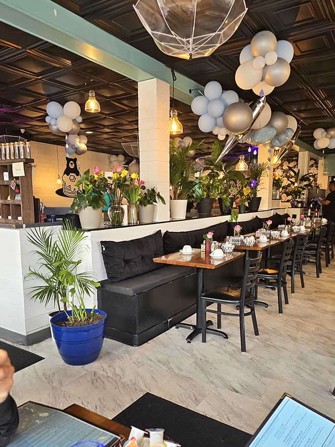 Plants and pendant lights create a space that feels both trendy and timeless, like your coolest friend's apartment&mdash;but with better food.