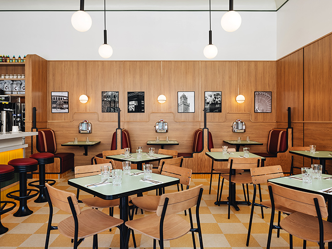 Clean lines, warm wood, and thoughtful design create a space where lingering over that second cup of coffee feels like the right thing to do.