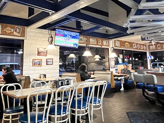 The dining room where Lakers memorabilia meets pendant lighting, creating that perfect "everybody knows your order" neighborhood vibe.