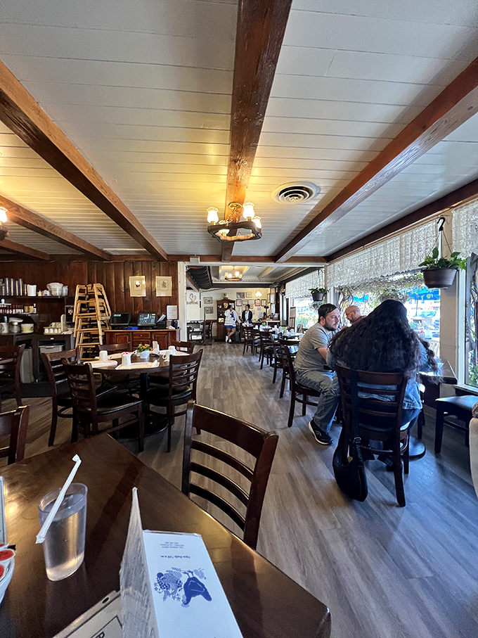 The dining room hums with the symphony of breakfast conversation. Wood beams overhead watch generations of happy diners come and go.