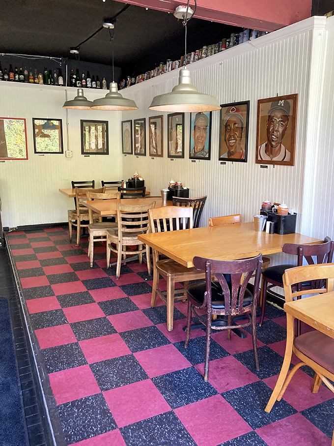 Mismatched chairs, checkerboard floors, and walls adorned with baseball legends create a dining room that feels like your coolest friend's basement hangout.