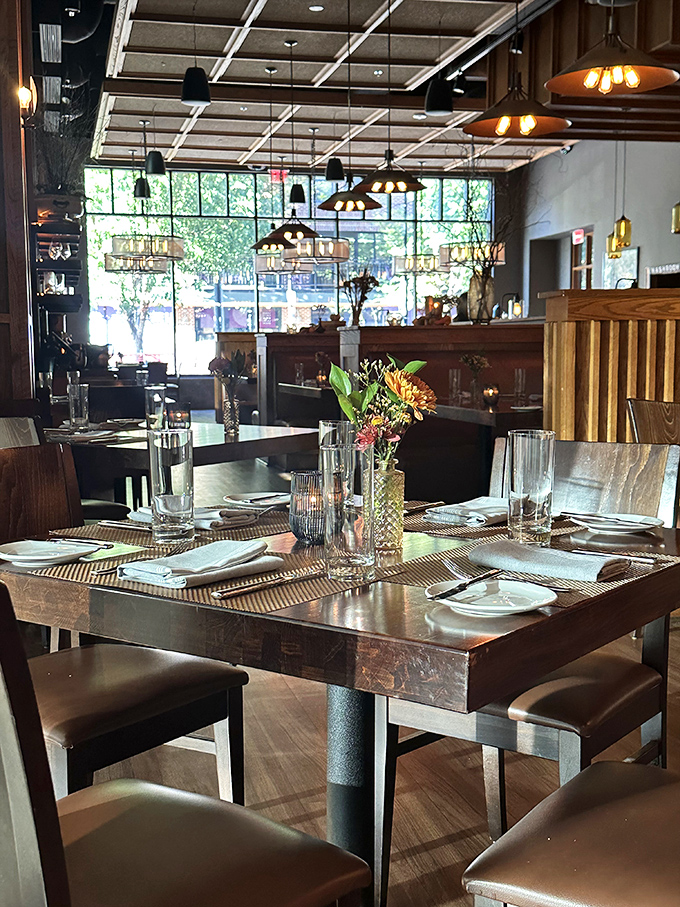 Tables set with anticipation&mdash;each place setting awaits its starring role in someone's perfect evening out.