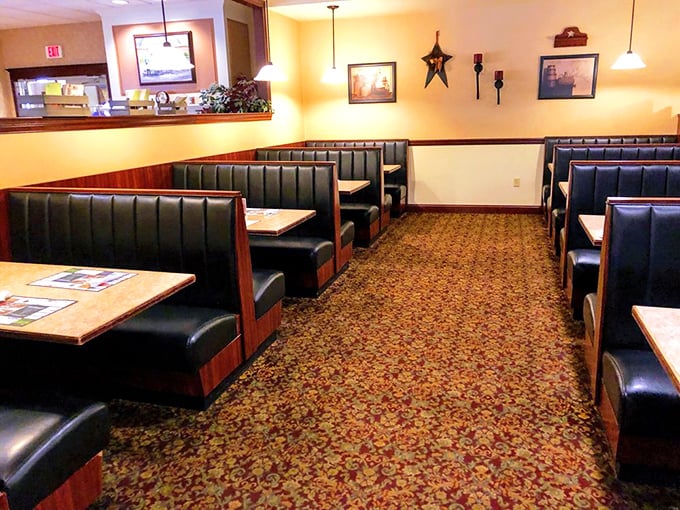 Booth seating arranged with mathematical precision. The kind of dining room where family arguments pause and food becomes the great unifier.