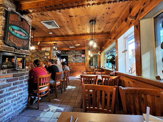 The dining room feels like it was carved from the heart of a giant pine tree &ndash; all wooden warmth and fishing memorabilia, where calories don't count and conversations flow easily.