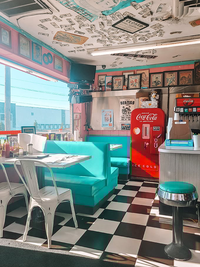 The pink walls and turquoise booths create the perfect backdrop for your breakfast dreams. That vintage Coca-Cola machine isn't just decoration &ndash; it's a sentinel of soda history.