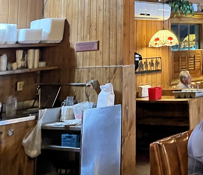 Behind the scenes, the kitchen area reveals the no-nonsense approach that has kept loyal customers coming back for decades.