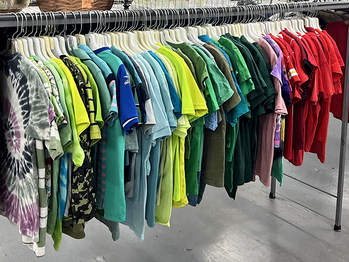 The technicolor dream rack of t-shirts arranged like a wearable rainbow. From tie-dye to neon, your next favorite shirt is hiding here.