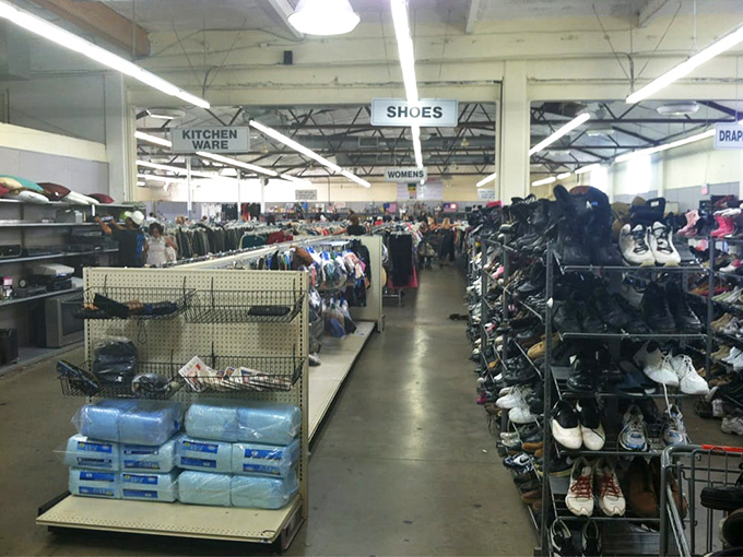 Footwear for every journey, arranged with surprising precision. Someone's barely-worn hiking boots might be your next adventure companion.