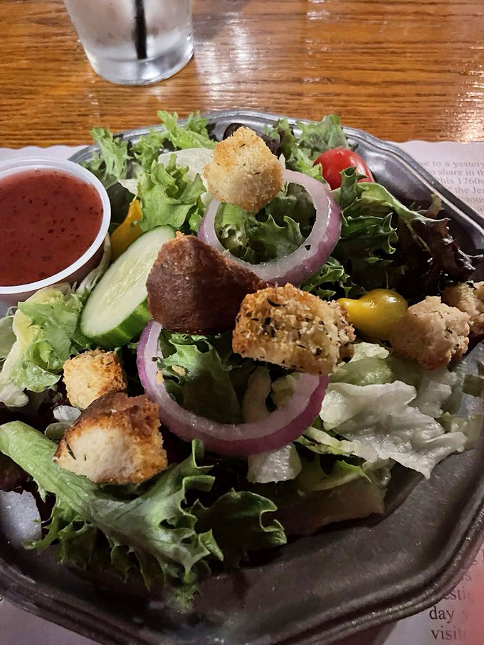 A house salad that knows its role&mdash;fresh, crisp, and ready to prepare your palate for the meaty main event waiting in the wings.